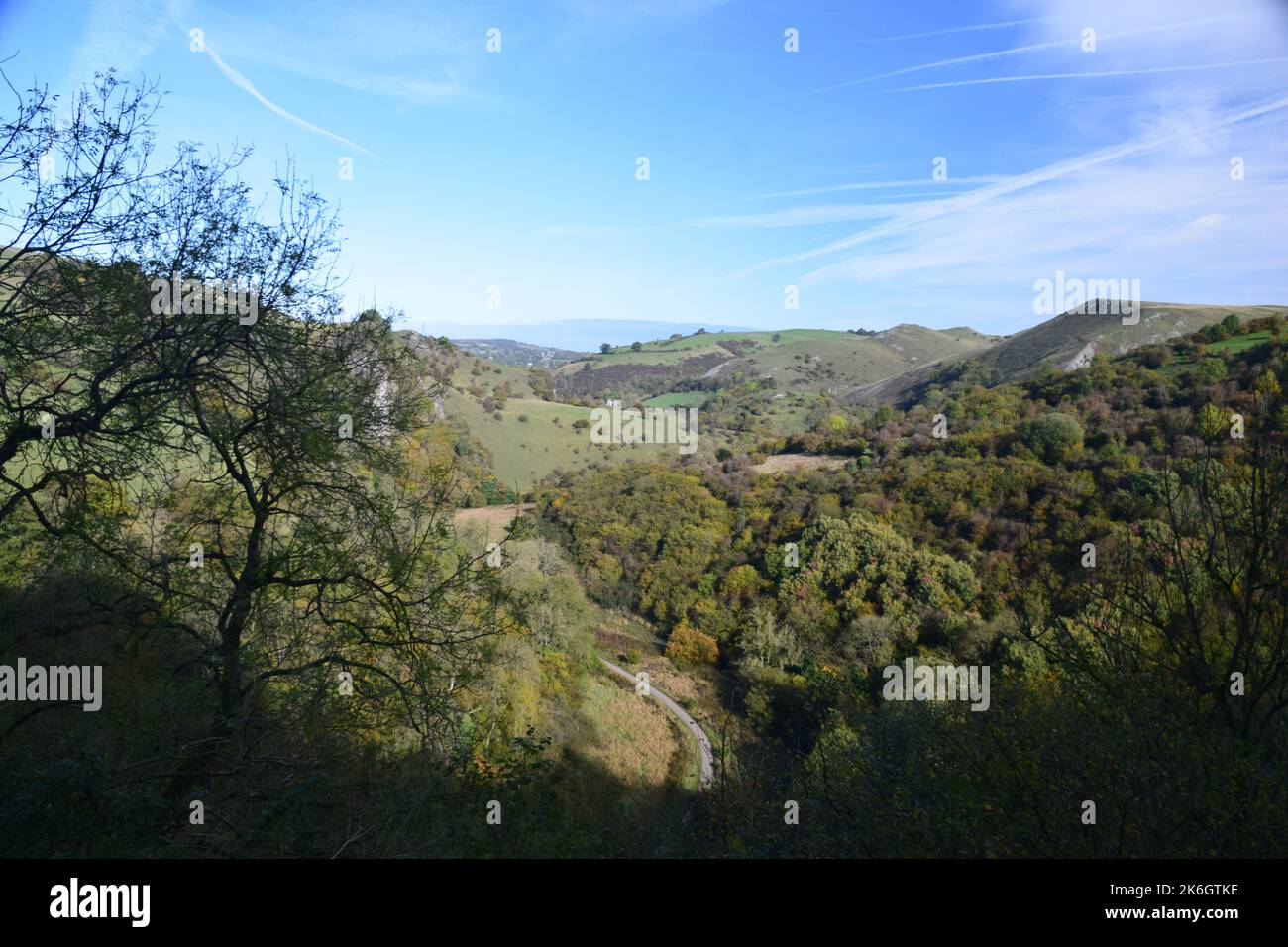 The wooded hillsides and limestone pinnacles along the Manifold valley ...