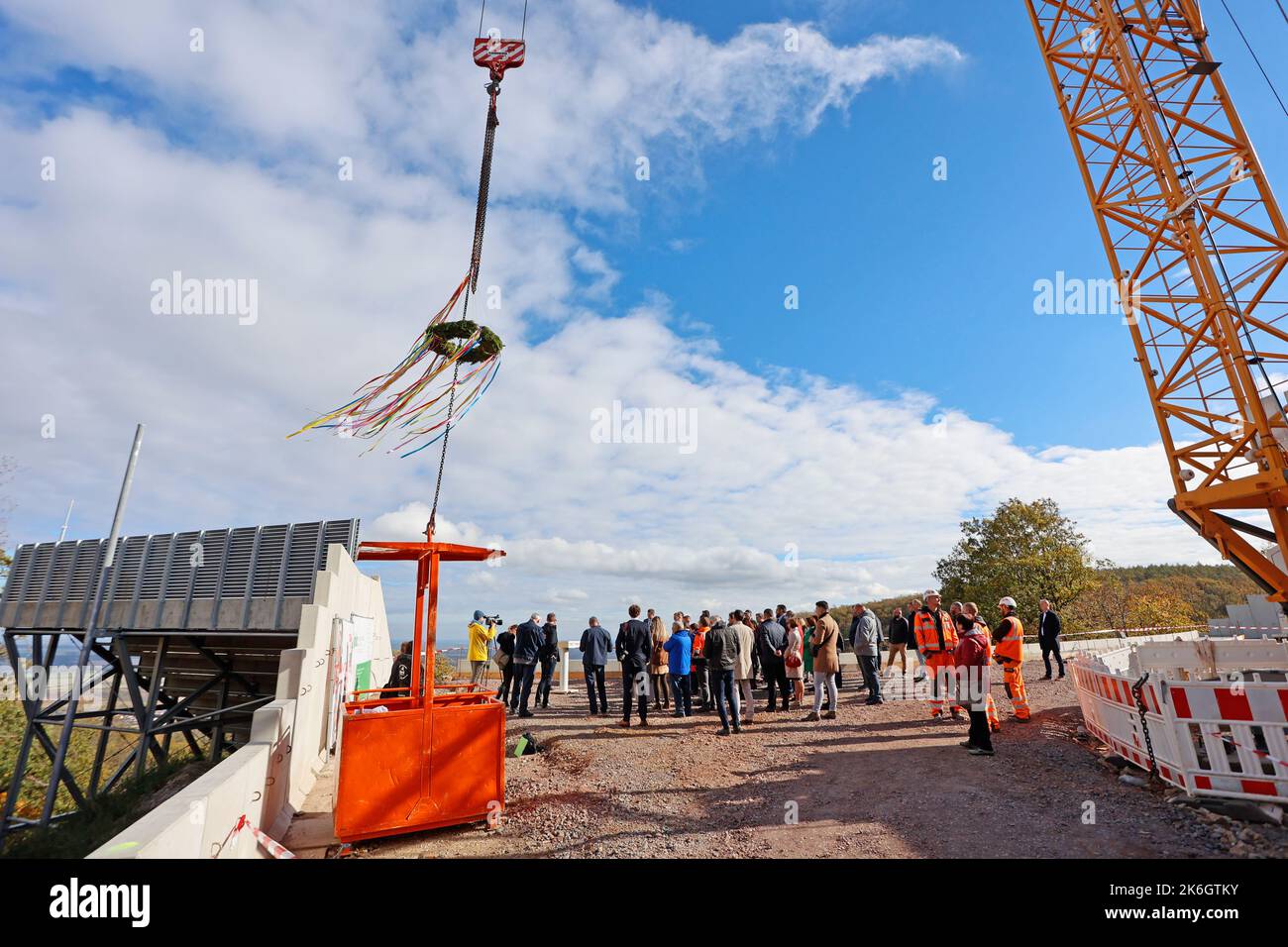 Thale, Germany. 14th Oct, 2022. A topping-out crown hangs from the ...