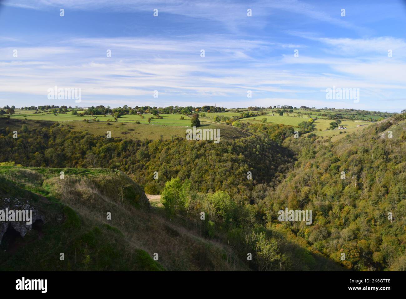 The wooded hillsides and limestone pinnacles along the Manifold valley ...