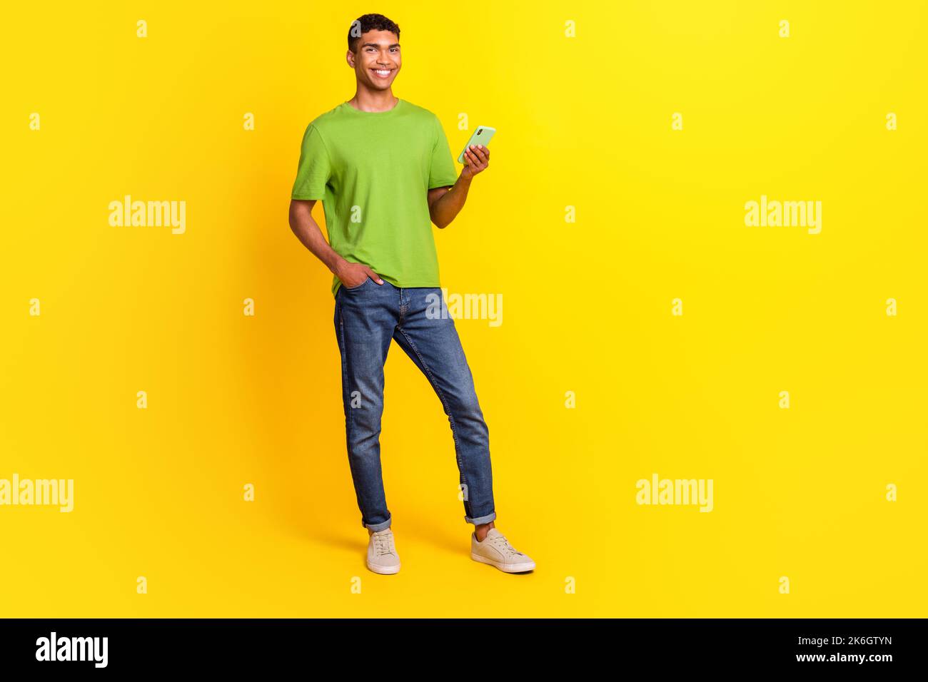 Full length photo of cheerful person hold use telephone chatting ...