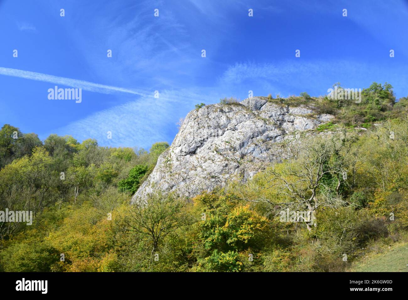 The wooded hillsides and limestone pinnacles along the Manifold valley ...