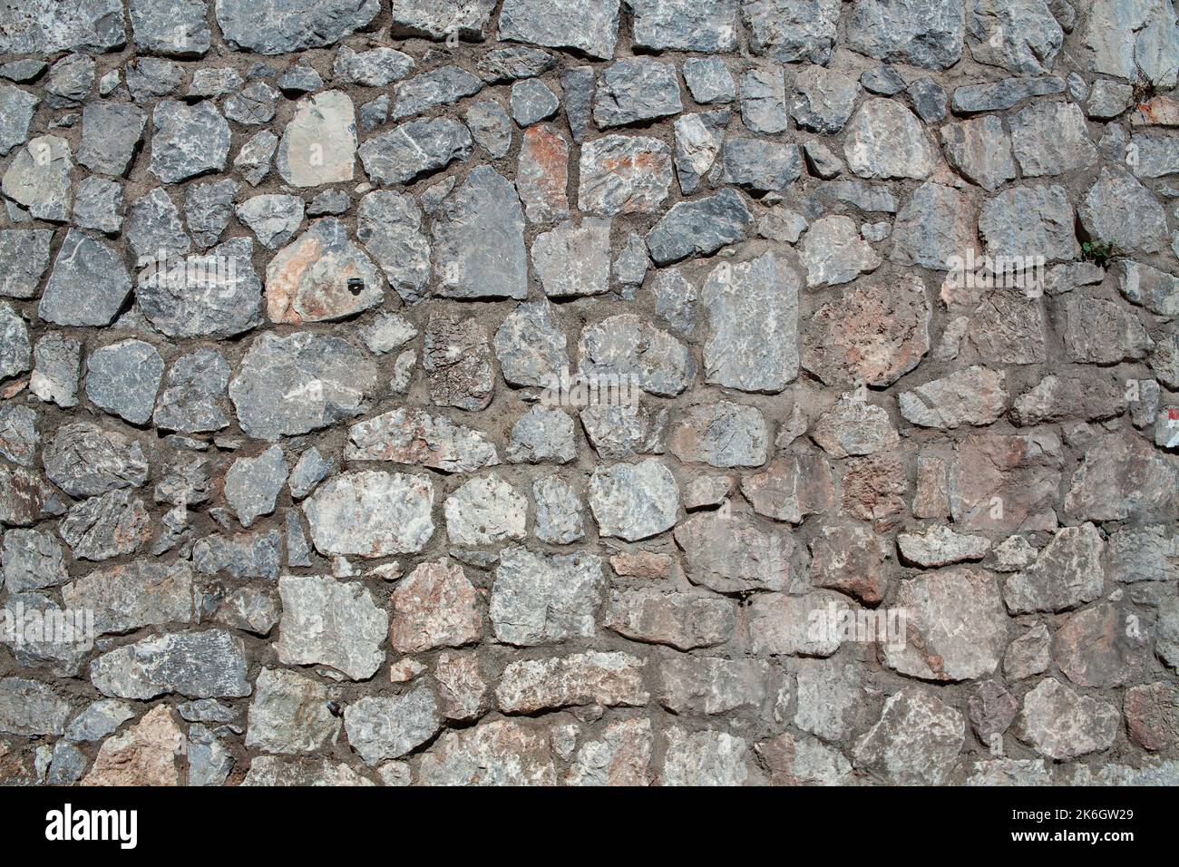 Old stone wall texture background. Rough stone wall. Big rough stones fence Stock Photo - Alamy