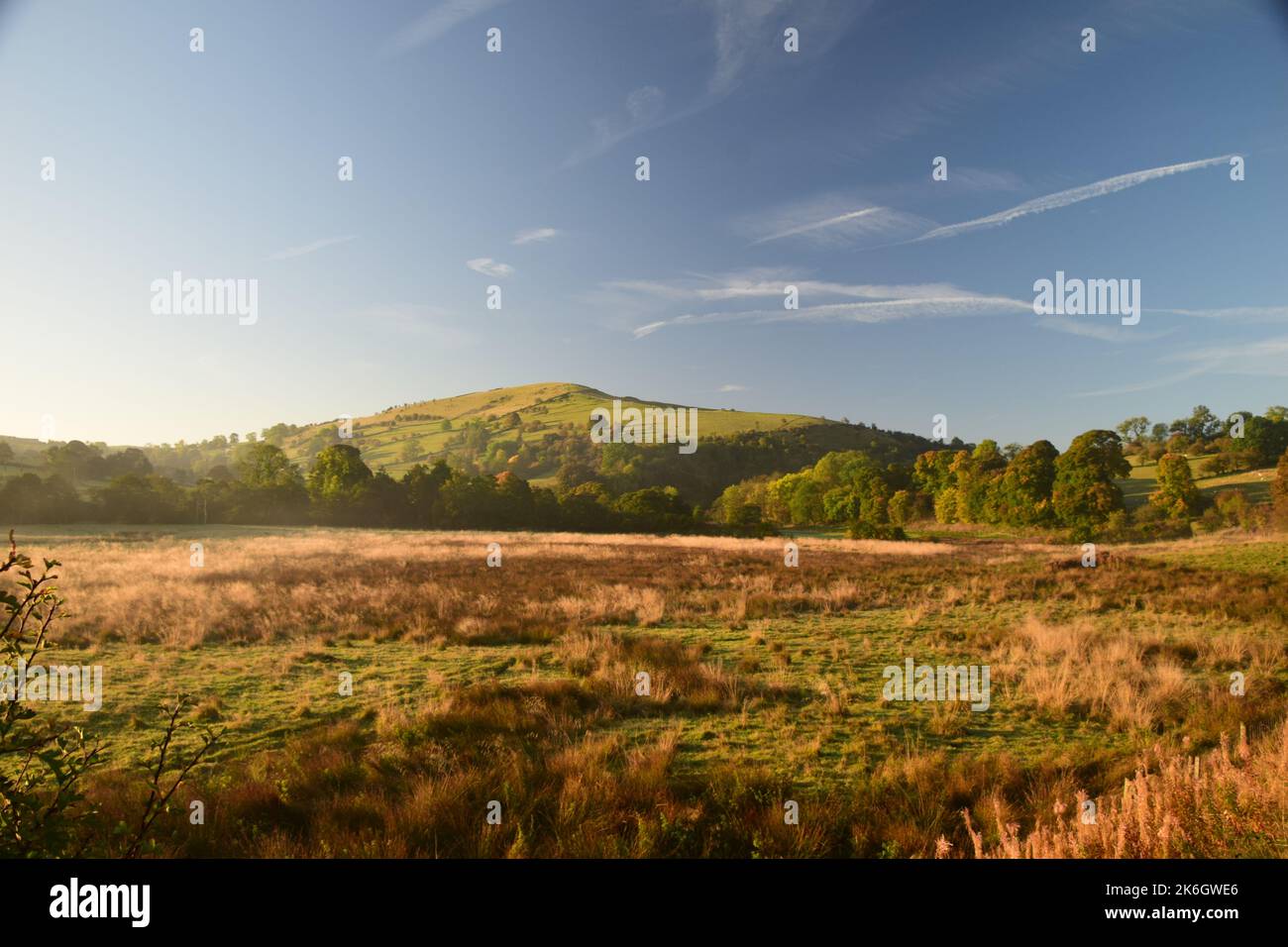 The wooded hillsides and limestone pinnacles along the Manifold valley ...