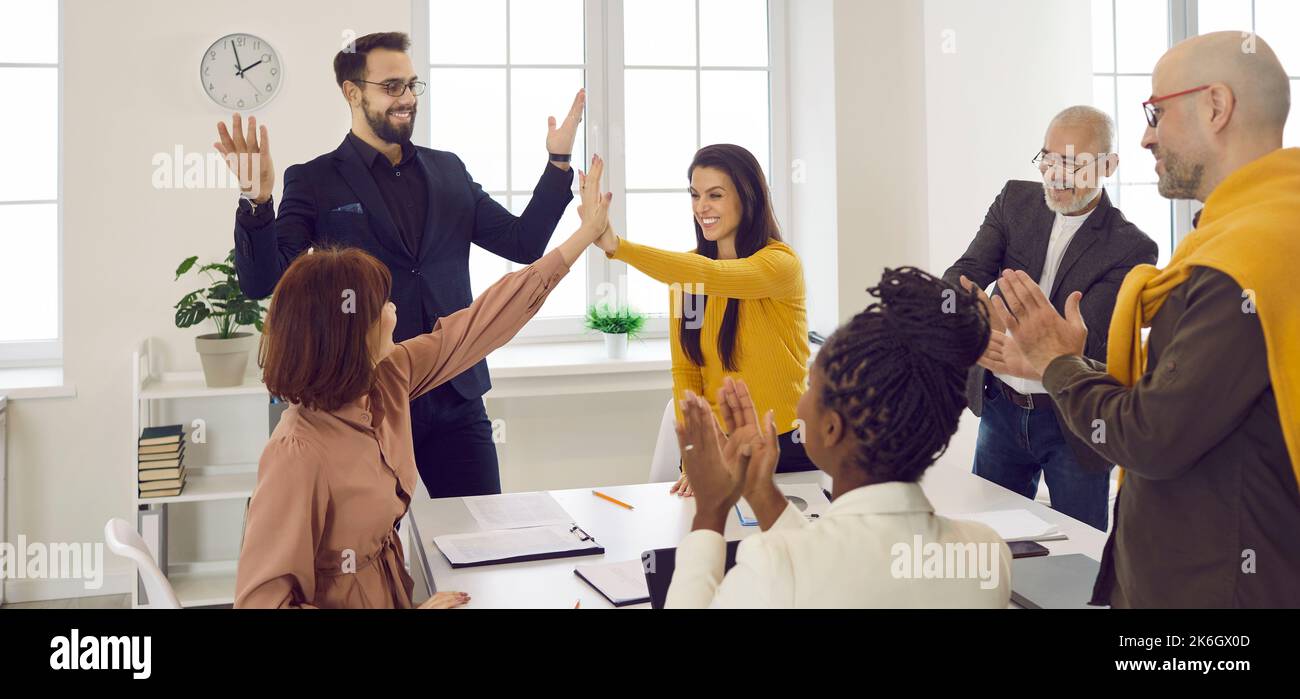 Two happy successful business women give each other high five after job ...