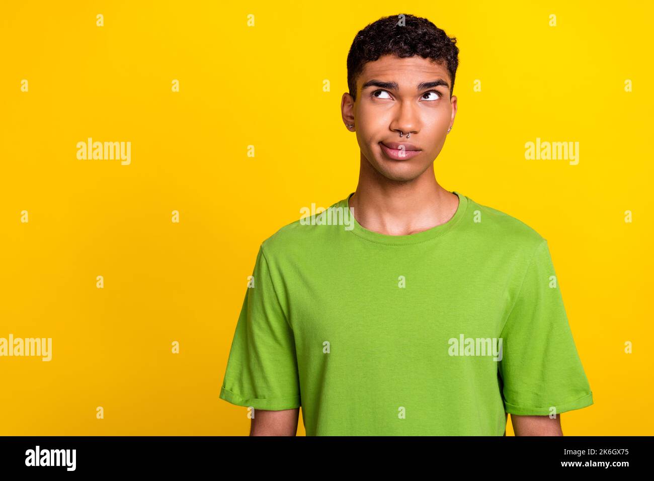 Photo of minded doubtful person look interested empty space hesitate ...