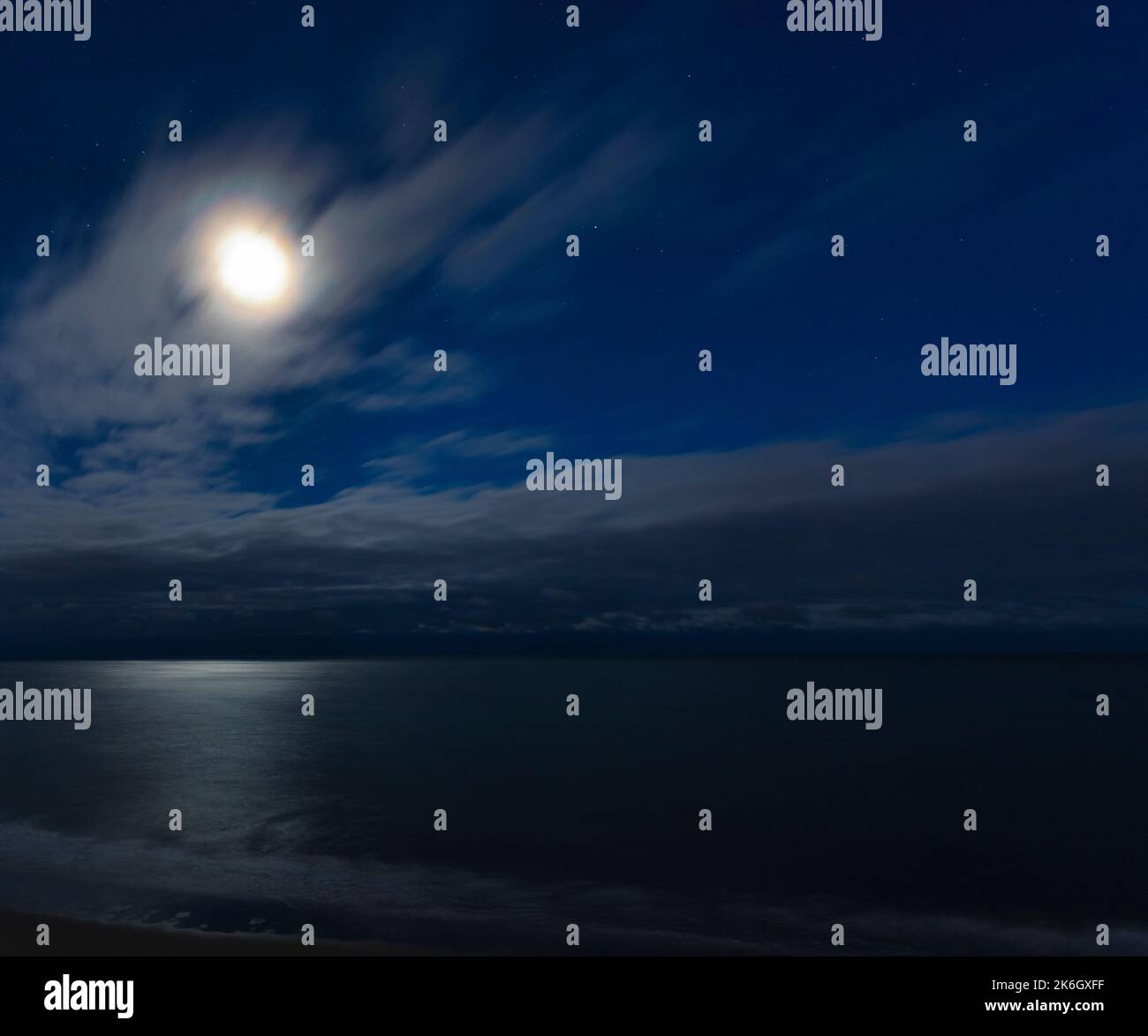 Moon on a clouded night over Myrtle Beach in South Carolina Stock Photo - Alamy