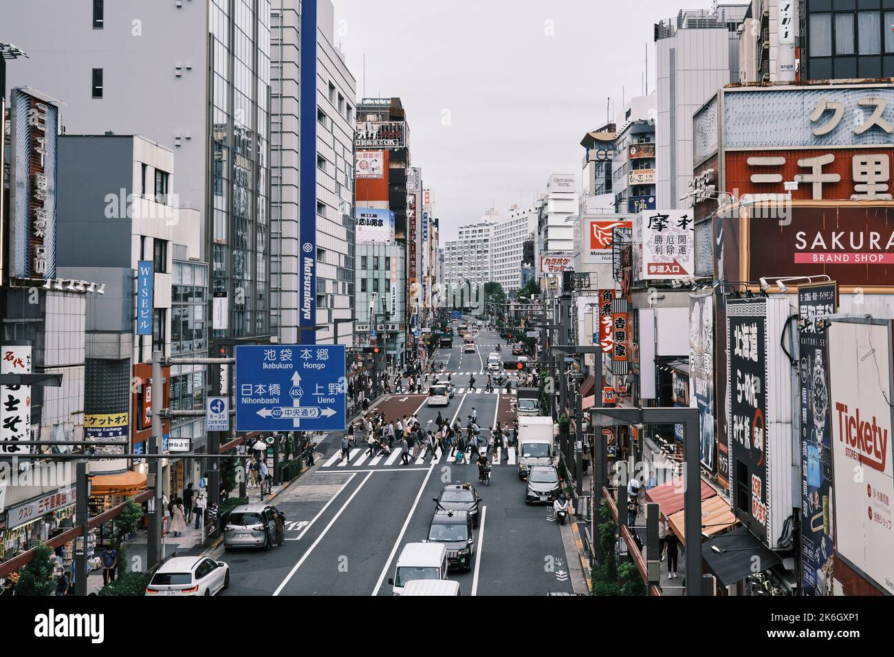An aerial of a busy Japanese street with shops and street signs in ...