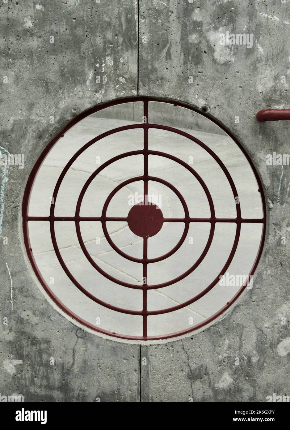 A vertical of circle target area in white and red on a wall Stock Photo ...