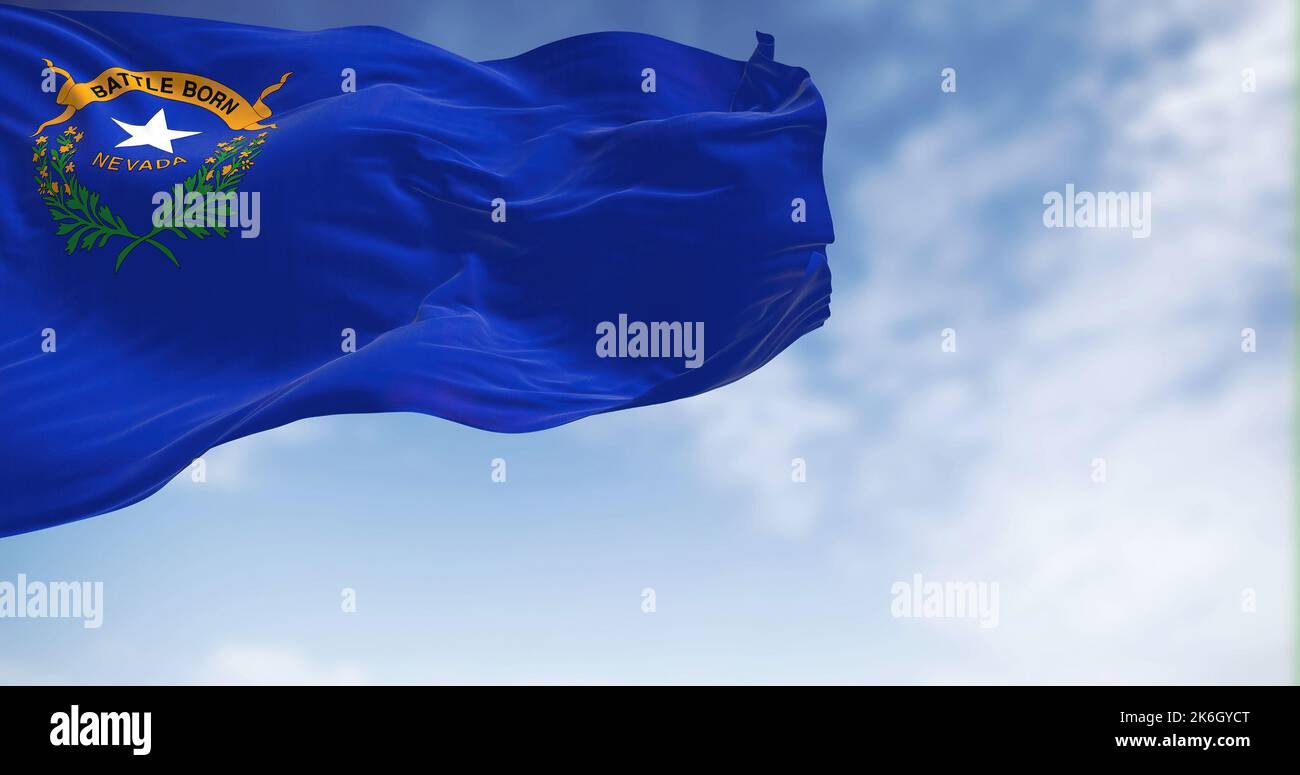 The Nevada state flag waving in the wind on a clear day. Nevada is a ...