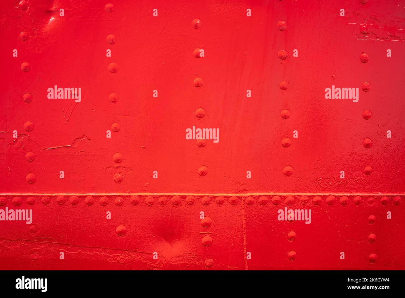 texture background with red metal wall with rivets Stock Photo - Alamy