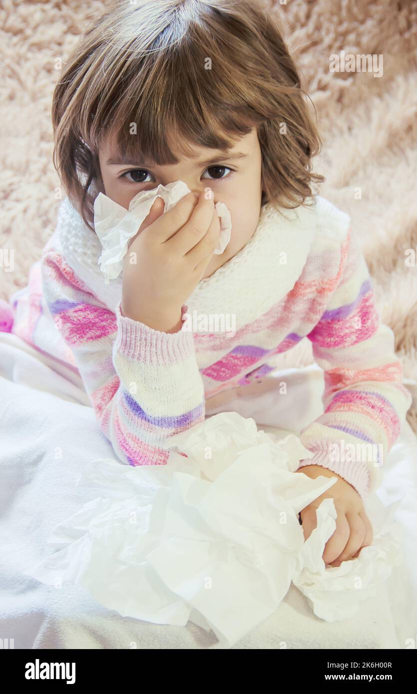 Cold at the child. Runny nose. Selective focus. Kids Stock Photo - Alamy