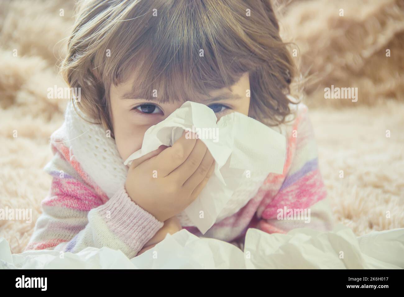Cold at the child. Runny nose. Selective focus. Kids Stock Photo - Alamy