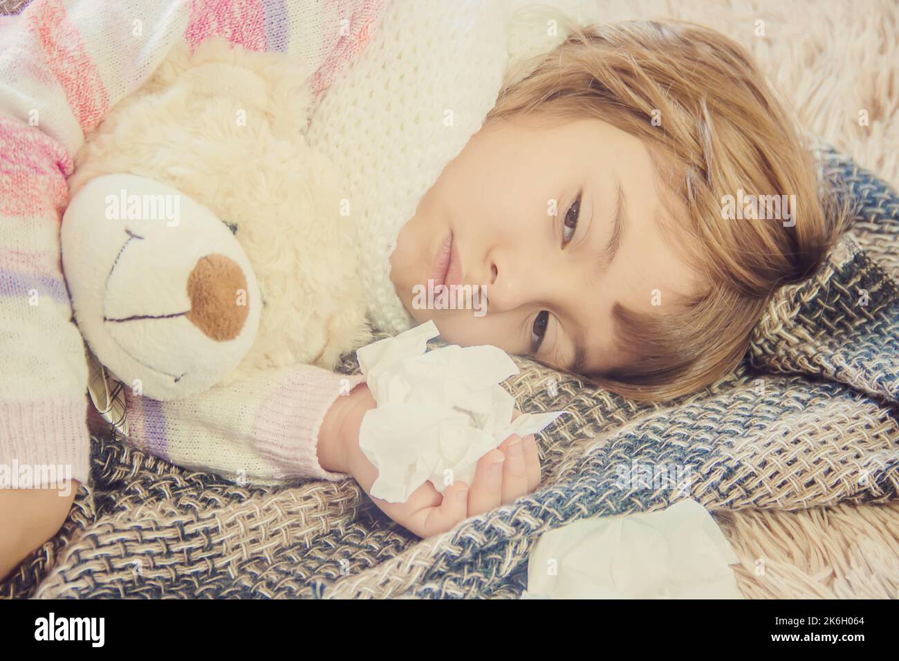 Cold at the child. Runny nose. Selective focus. Kids Stock Photo - Alamy