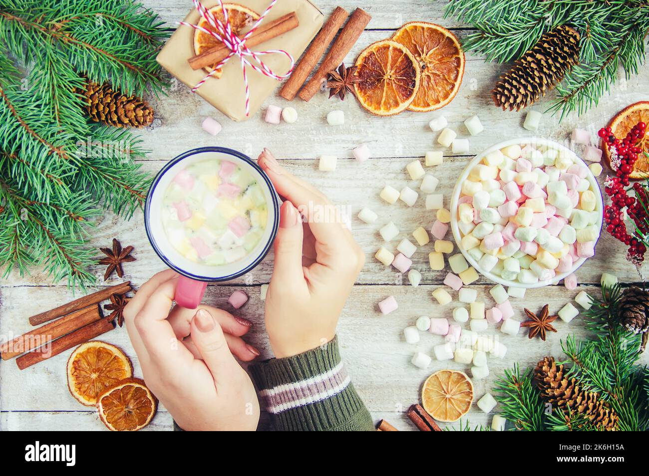 Hot chocolate and marshmallow on christmas background. Selective focus ...
