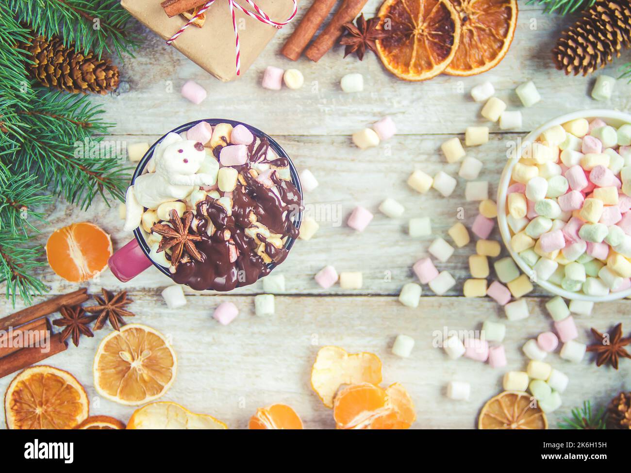 Hot chocolate and marshmallow on christmas background. Selective focus ...