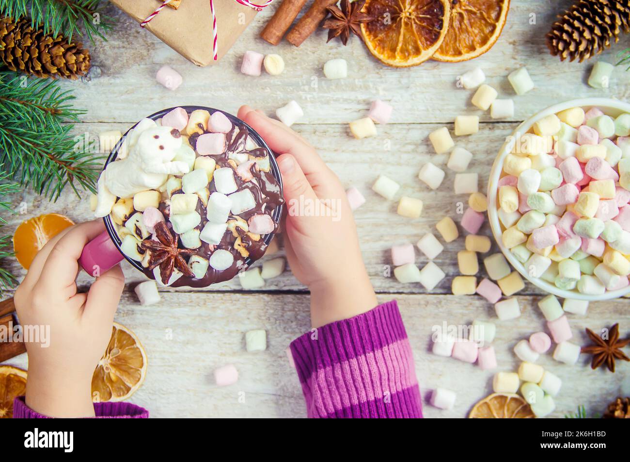 Hot chocolate and marshmallow on christmas background. Selective focus ...