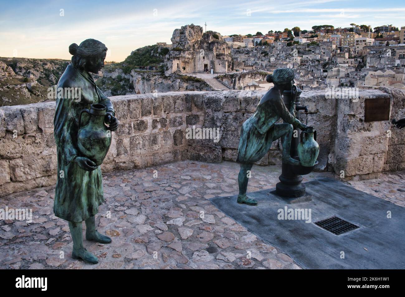 View of Matera behind the group of the bronze statues "Falling in love ...