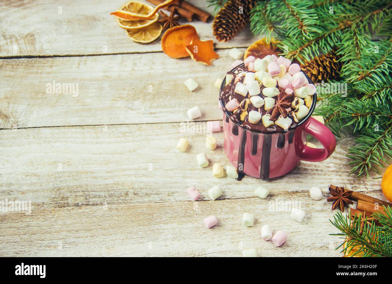 Hot chocolate and marshmallow on christmas background. Selective focus ...