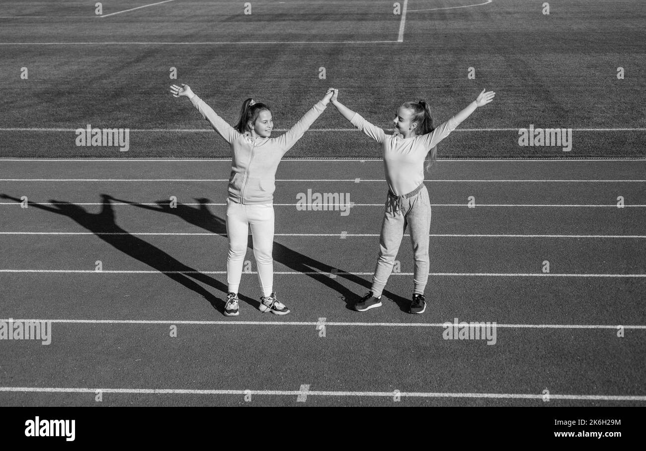 Sports really strengthen friendship. Happy friends hold hands on ...