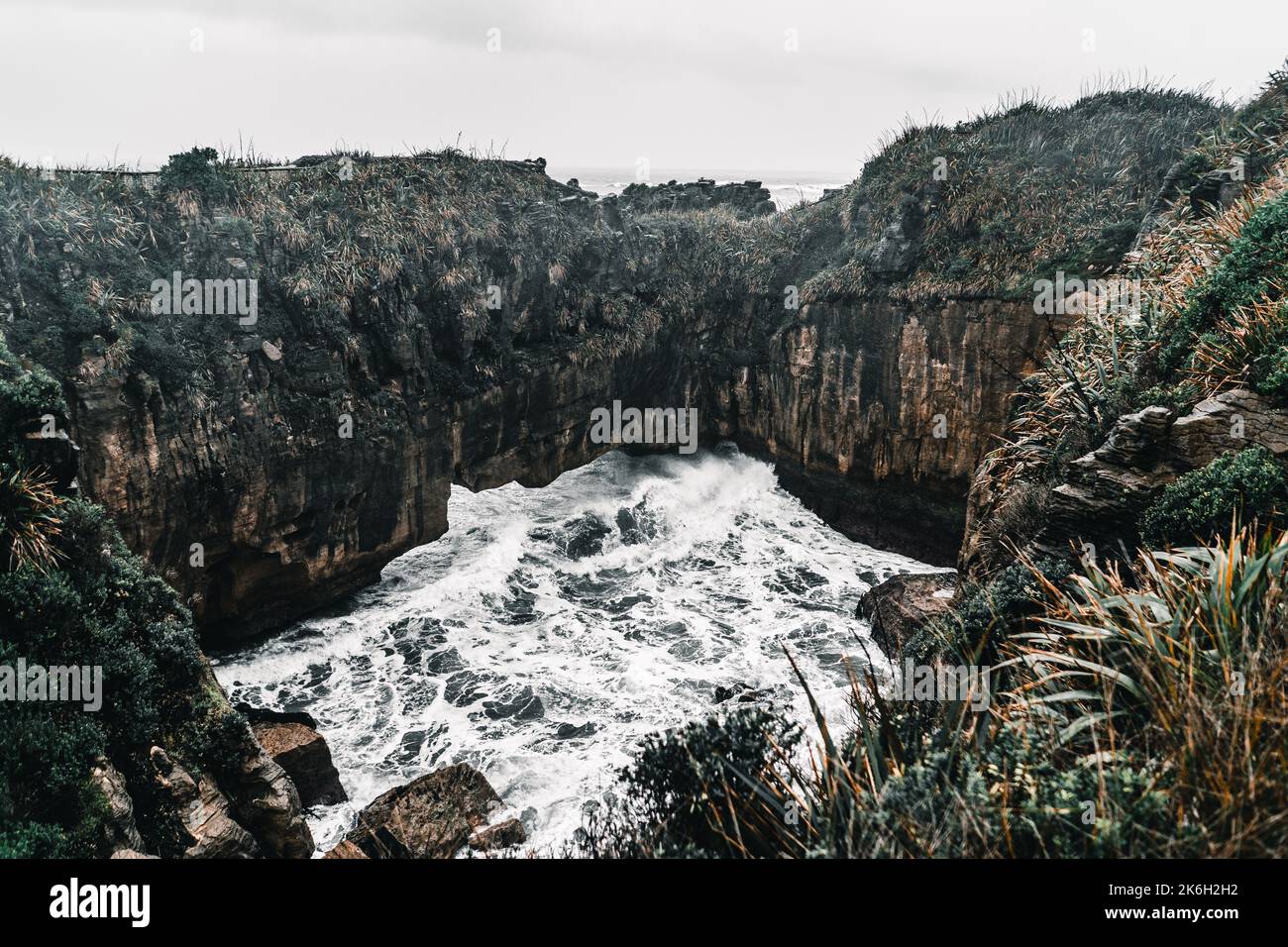 small lake formed by the violent waves of sea water between the ...