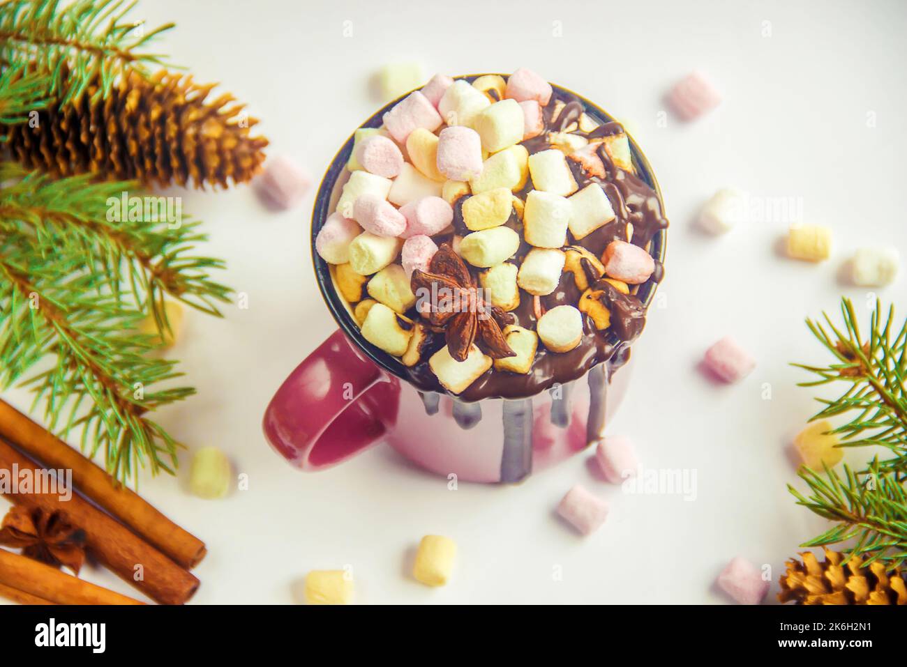 Hot chocolate and marshmallow on christmas background. Selective focus ...