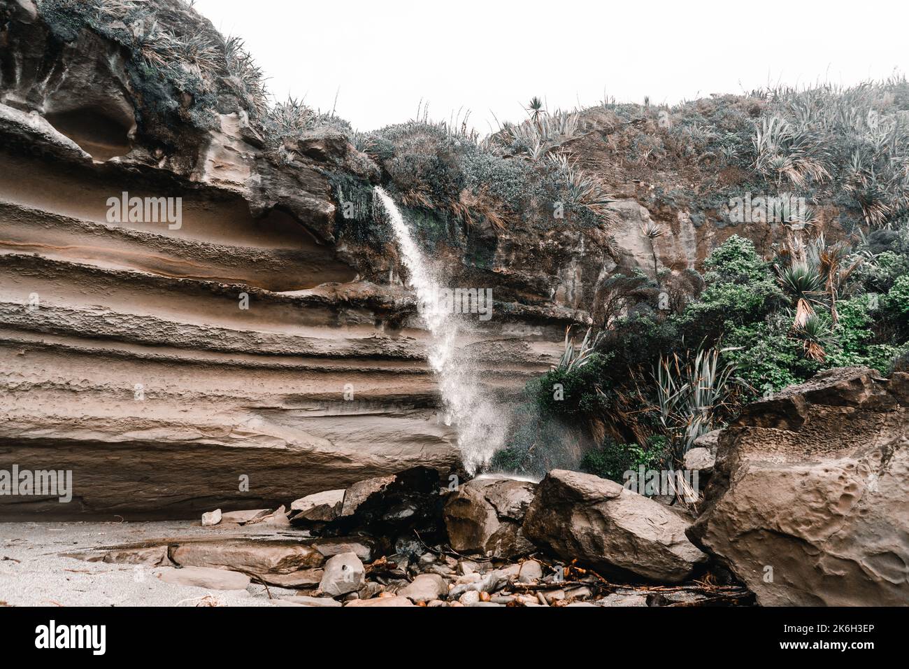 small waterfall with little water pushed by the force of the wind ...