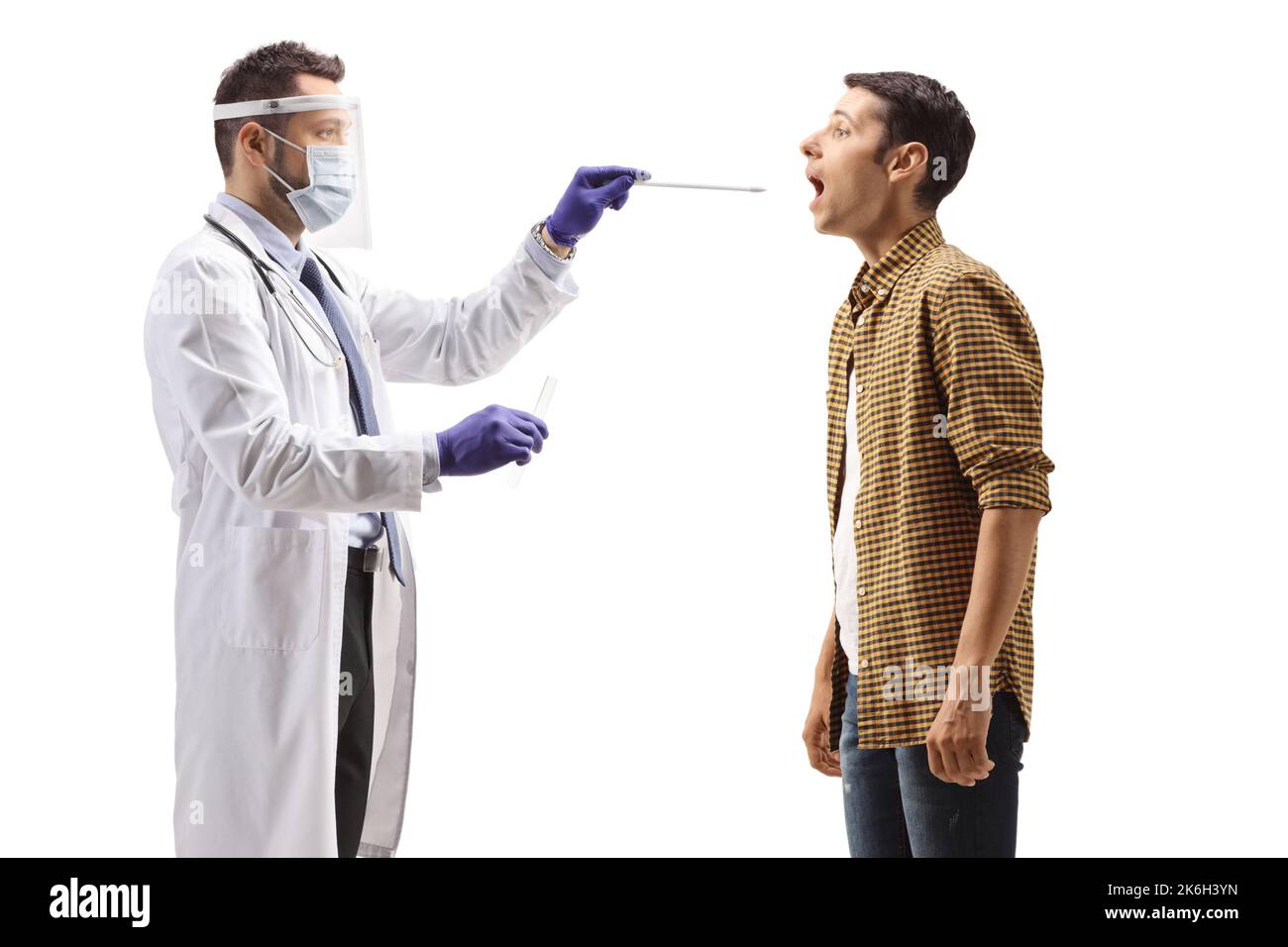 Doctor with face shield taking a cotton swab test from a young man ...