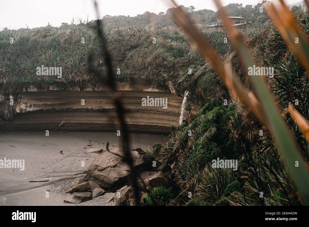 curious and beautiful place near the sea and the beach of rocks and ...