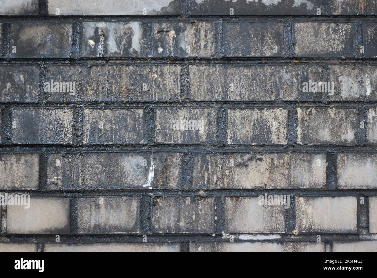 Dirty old brick wall dripping with grease and oil Stock Photo - Alamy