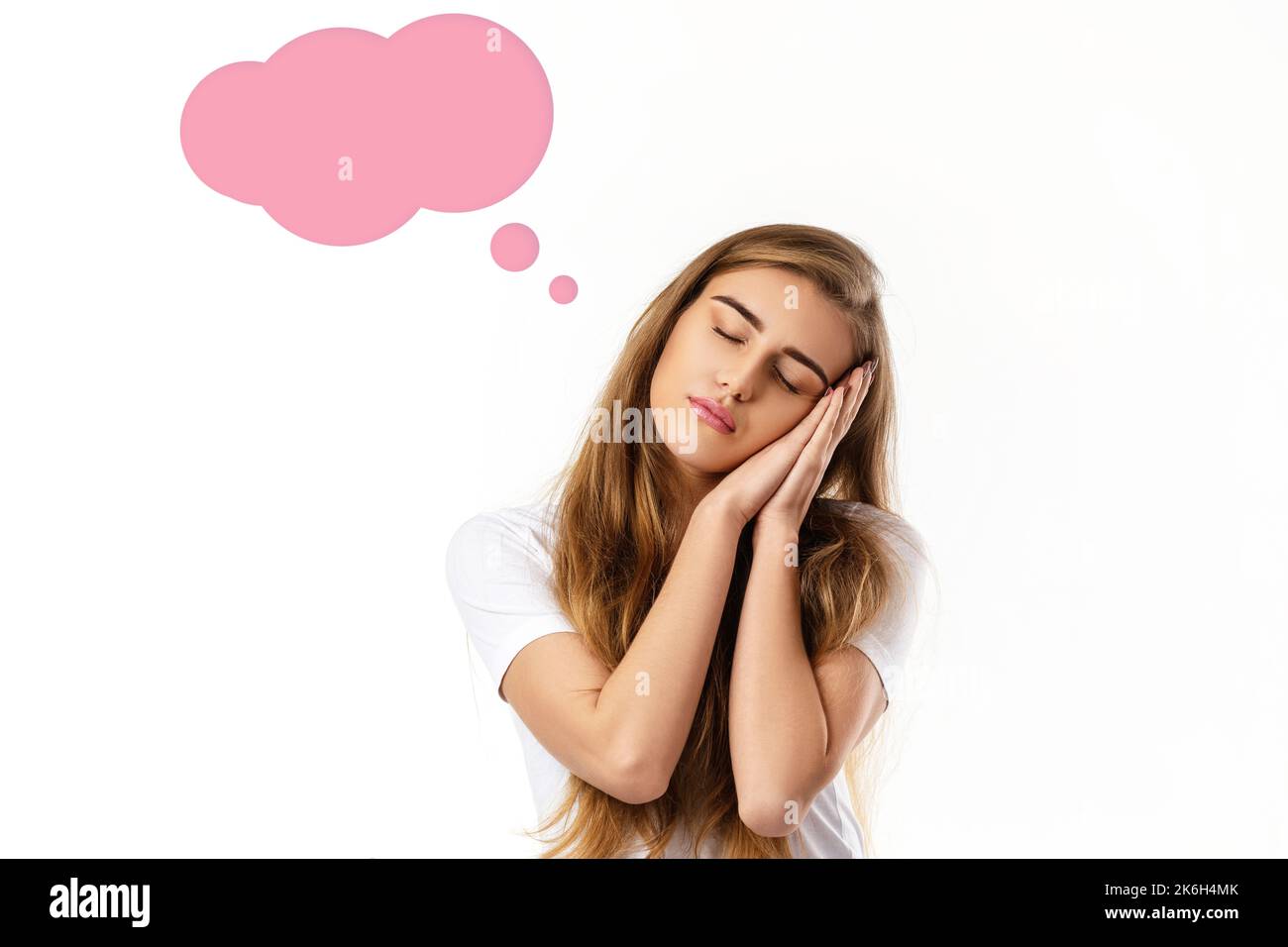 woman in t-shirt showing sleep gesture Stock Photo - Alamy