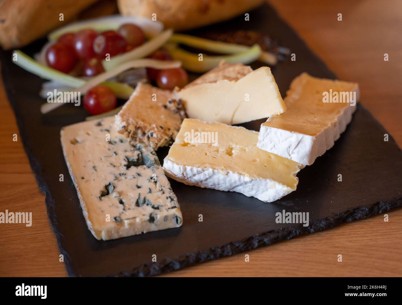 Tasting of fresh farmers scottish cheeses smoked cheddar, stilton, blue ...