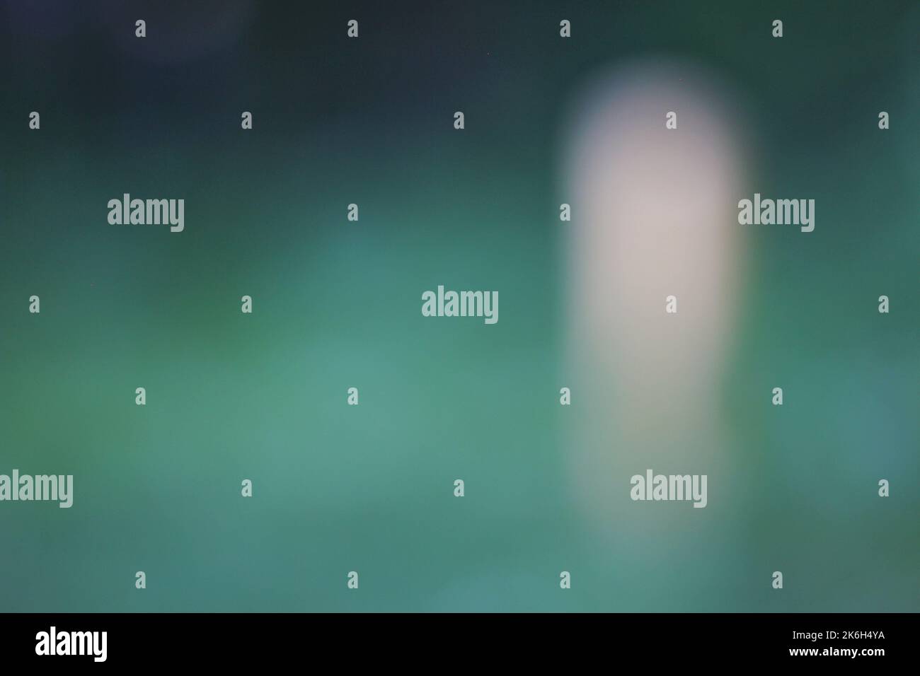 An abstract view of a pole and bollard standing straight in the fields ...