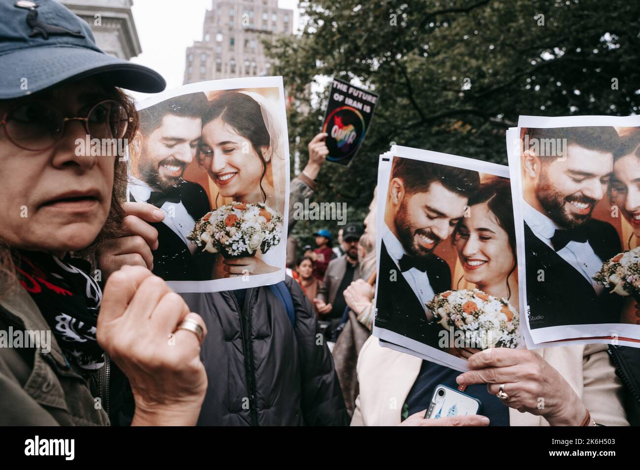 Multiple protestors hold up Mahsa Amini's wedding photos. Woman, Life ...