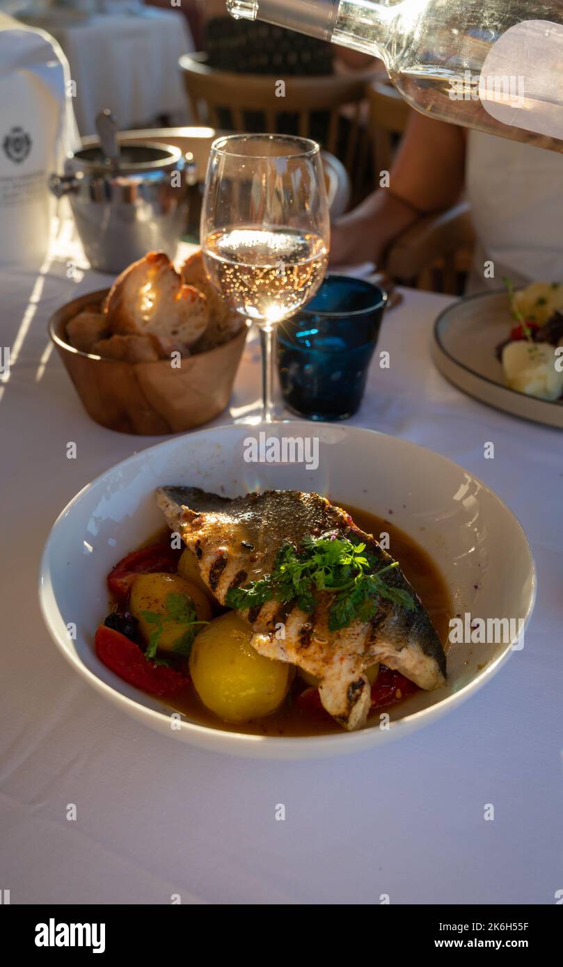 Provence cuisine, grilled filet of seabass white fish served with ...