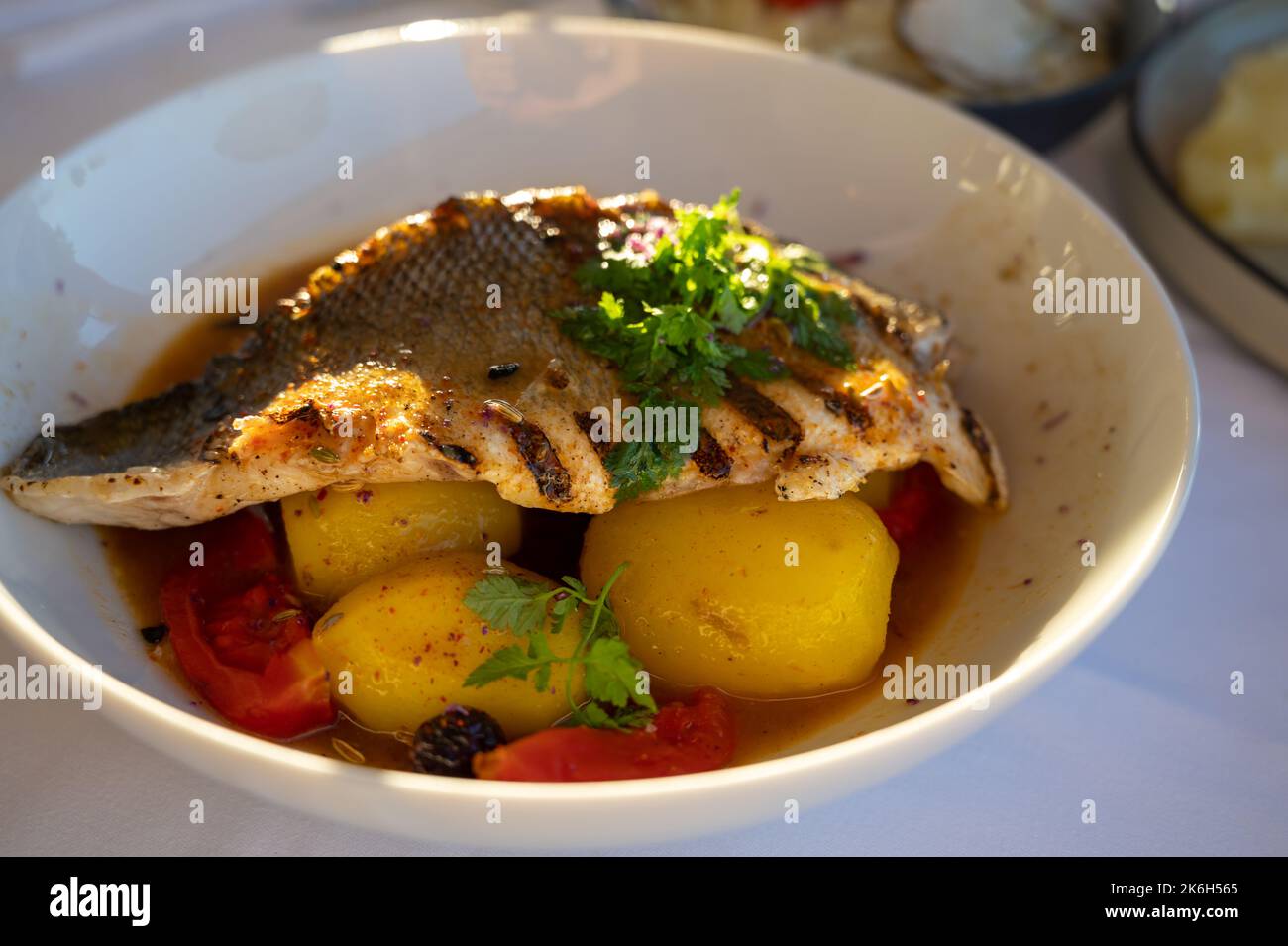 Provence cuisine, grilled filet of seabass white fish served with ...