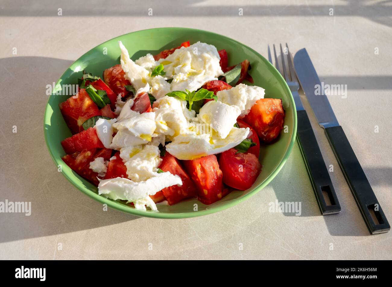 Itaian vegetarian food, fresh caprese salad made with white soft ...
