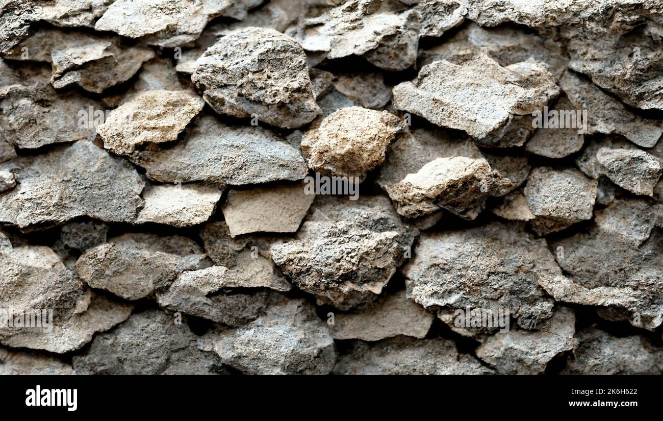 A rough wall of shapeless concrete stones Stock Photo - Alamy