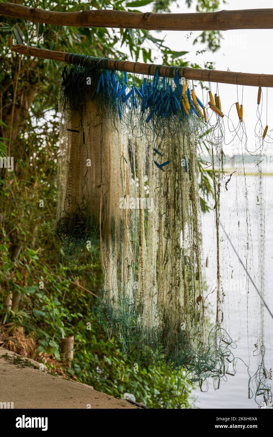 Close-up of fishing nets drying by the river Stock Photo - Alamy