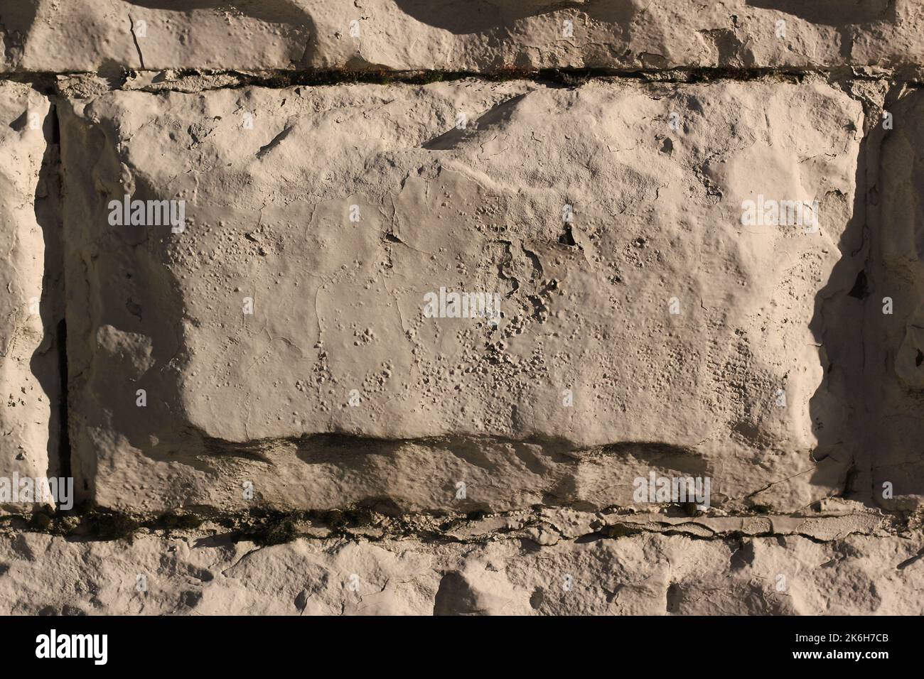 A typical common typical block natural stone wall Stock Photo - Alamy