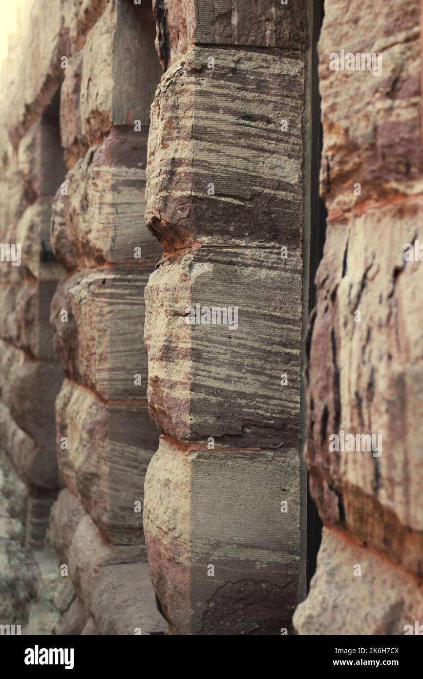 A typical common typical block natural stone wall Stock Photo - Alamy