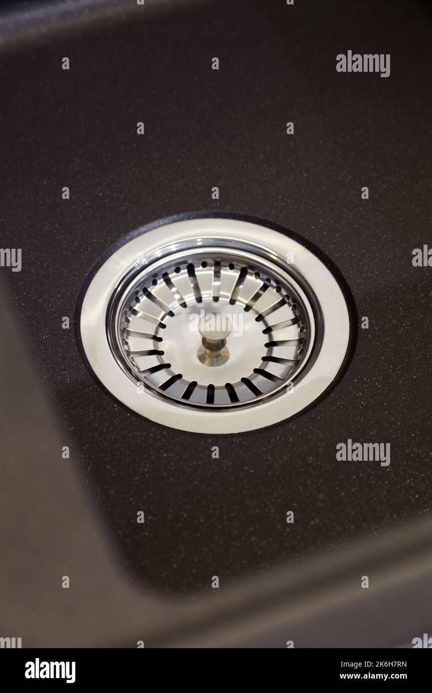 Black granite kitchen sink and stainless steel water drain, modern and ...