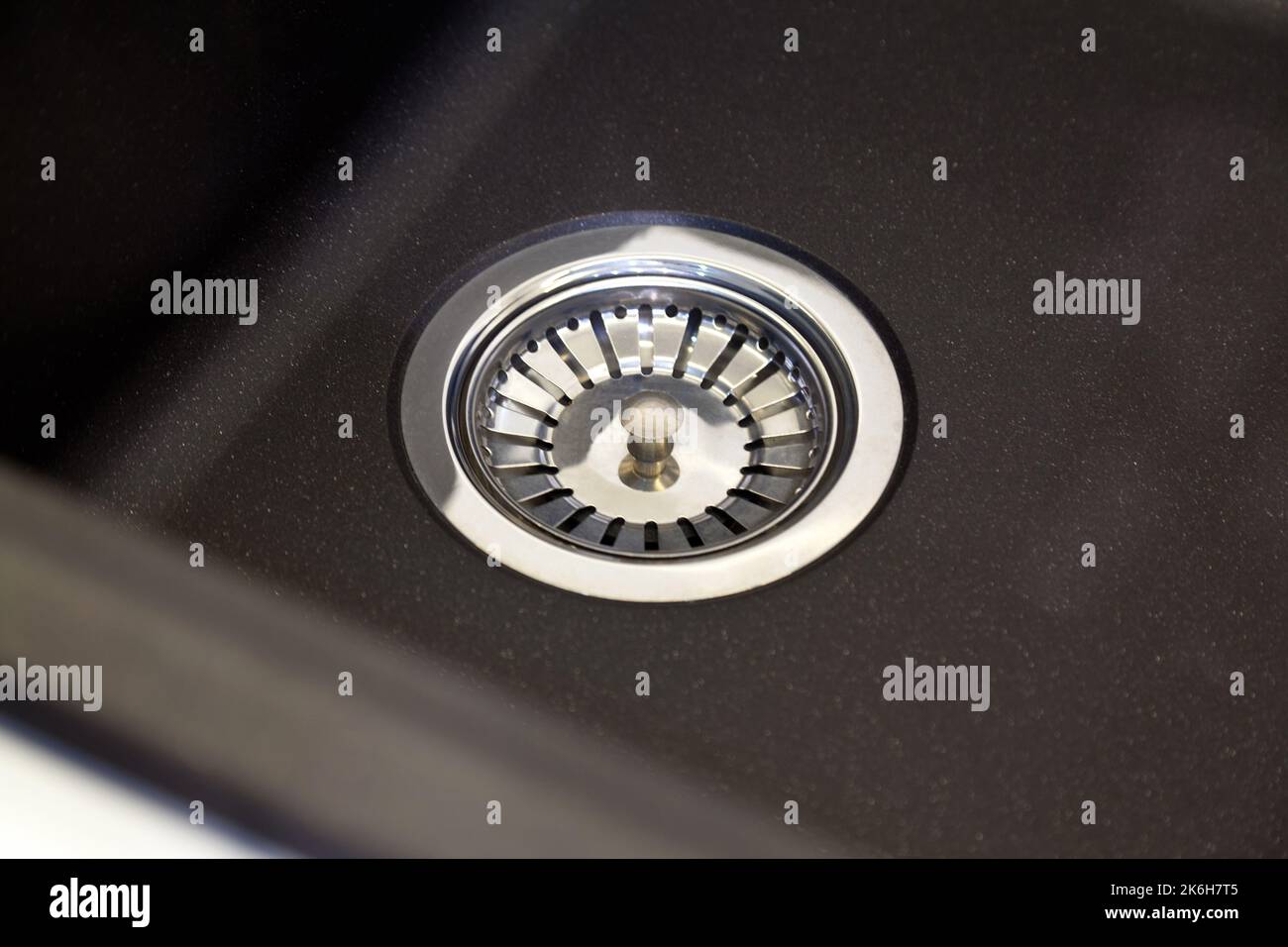 Black granite kitchen sink and stainless steel water drain, modern and ...