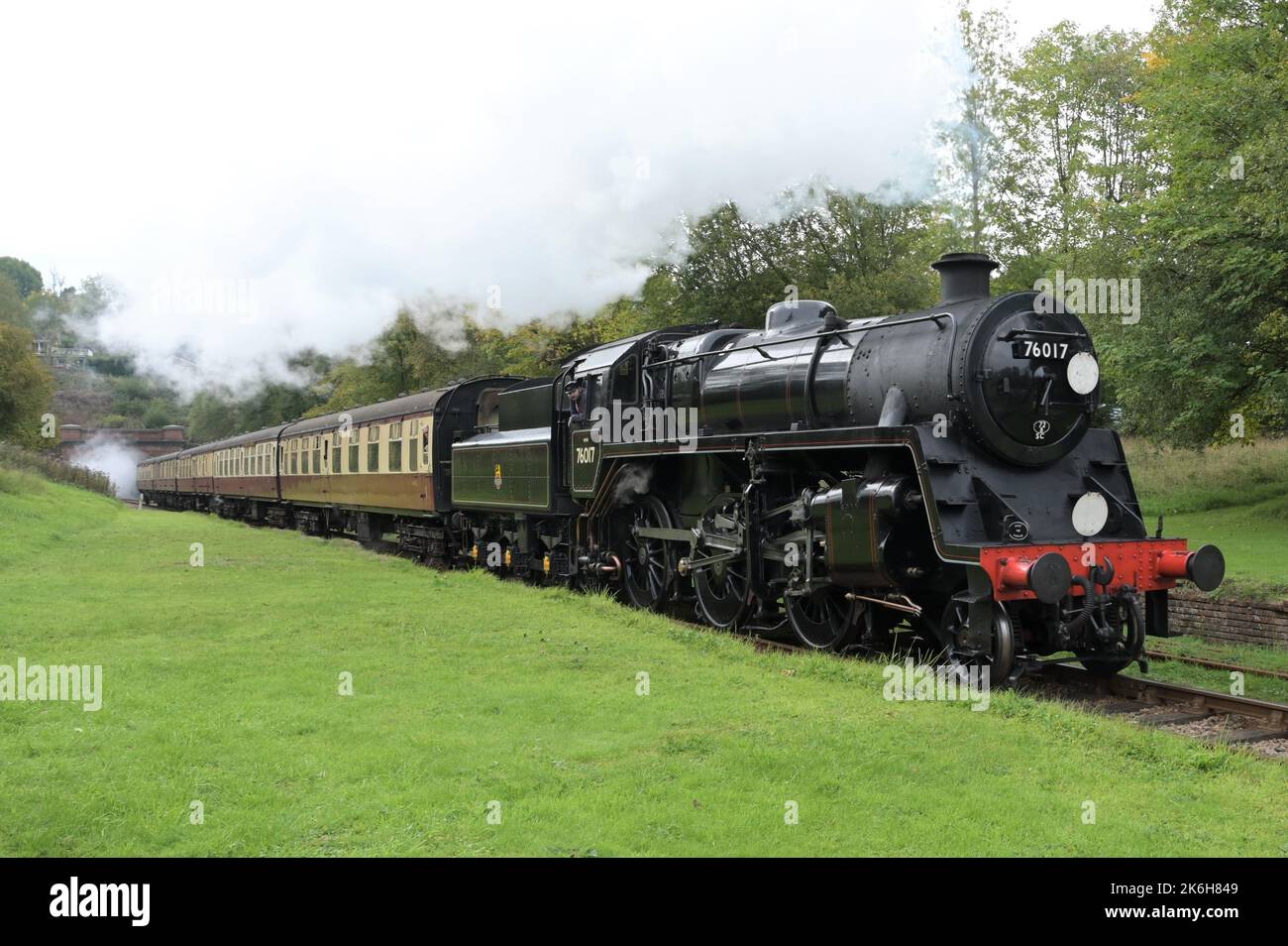 76017 a Standard class 4MT emerging from a tunnel on a Heritage railway ...