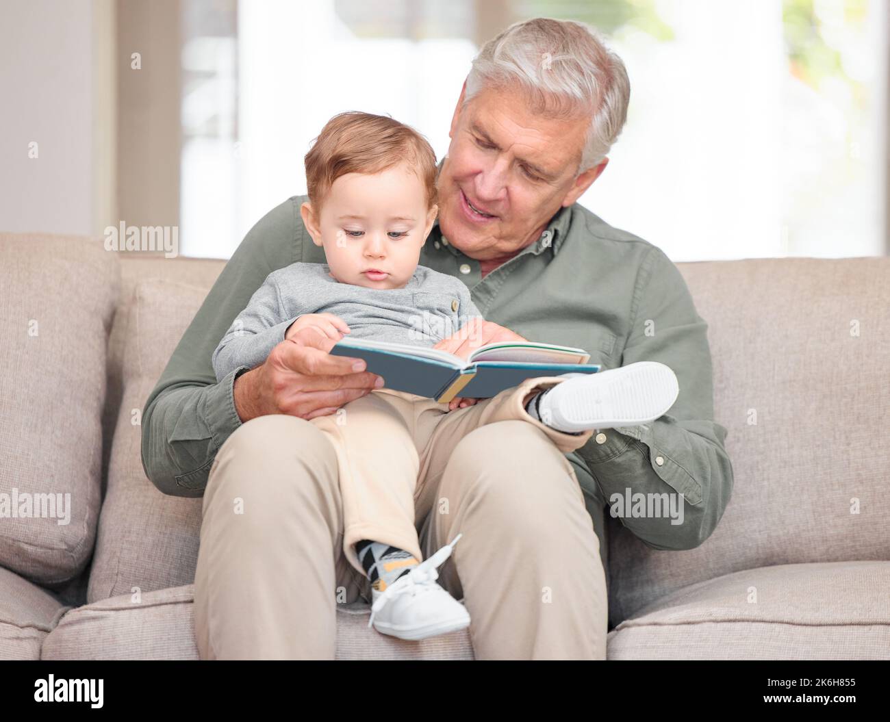 Grandfather reading story book grandson hi-res stock photography and ...