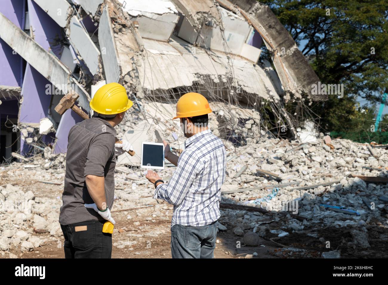 Demolition control supervisor and contractor discussing on demolish ...