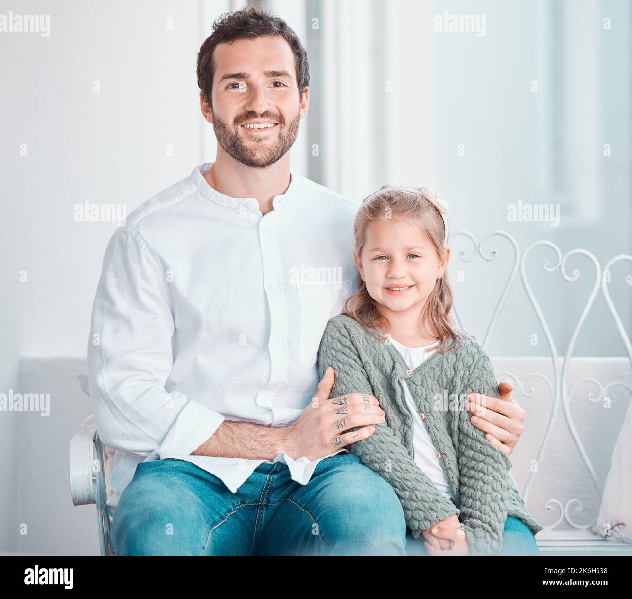 Adorable little caucasian girl bonding with her father at home. Caring ...