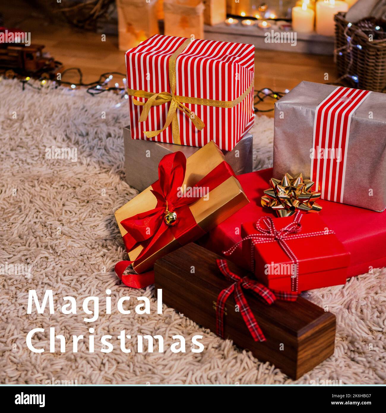 Composition of magical christmas text over presents Stock Photo - Alamy