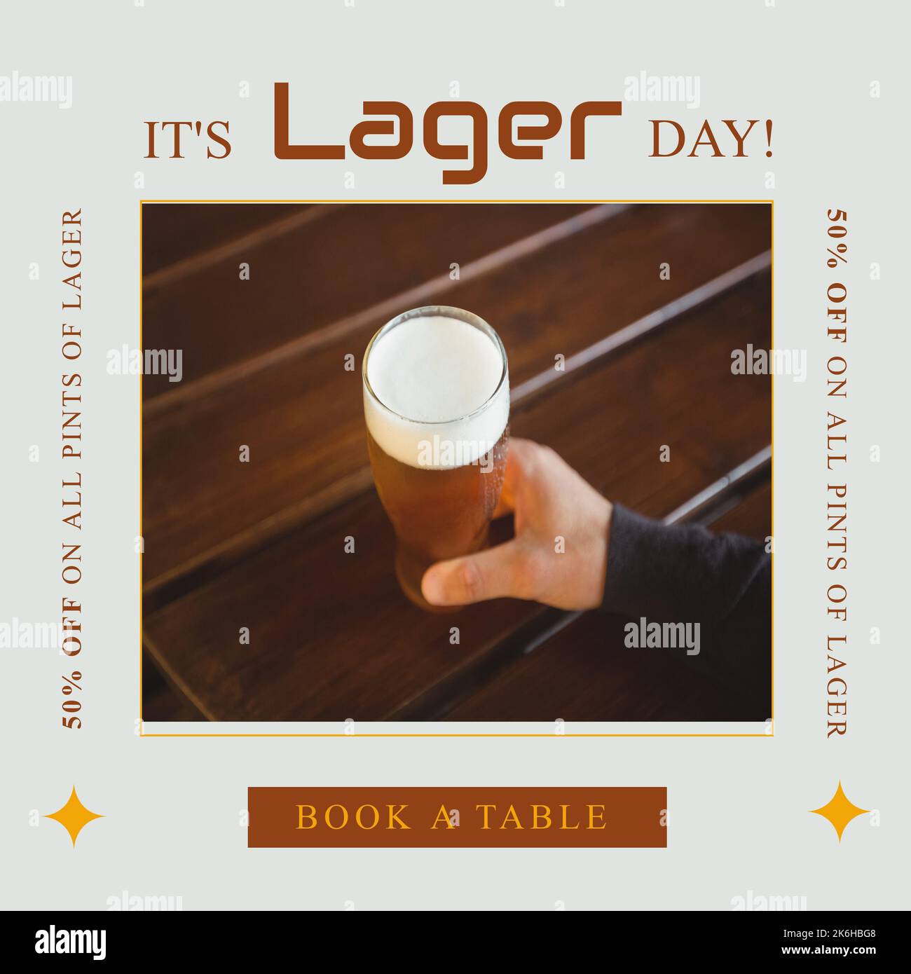 Composition of lager day text over hand with mug of beer Stock Photo ...