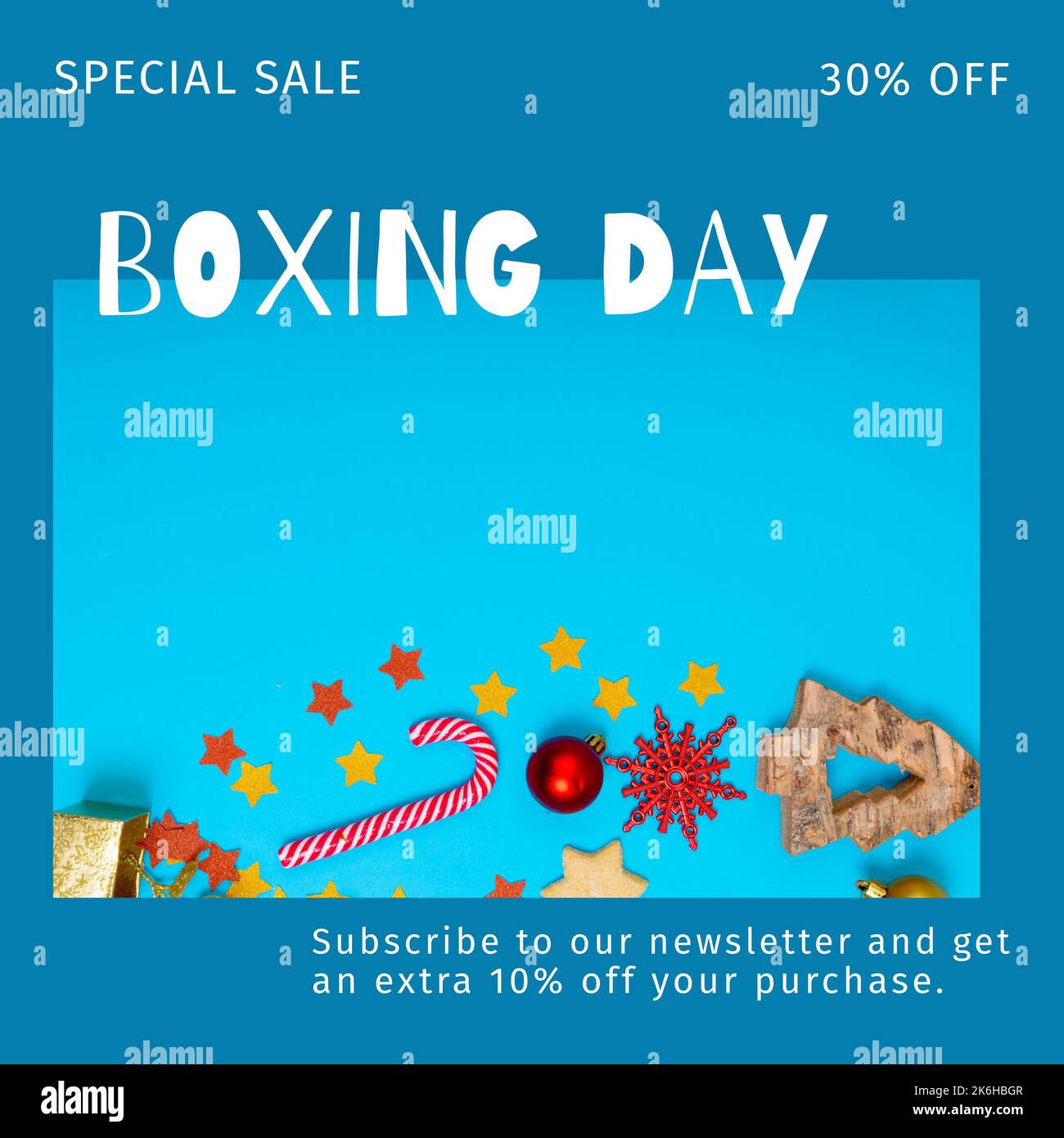 Composition of boxing day sales text over christmas decorations on blue ...