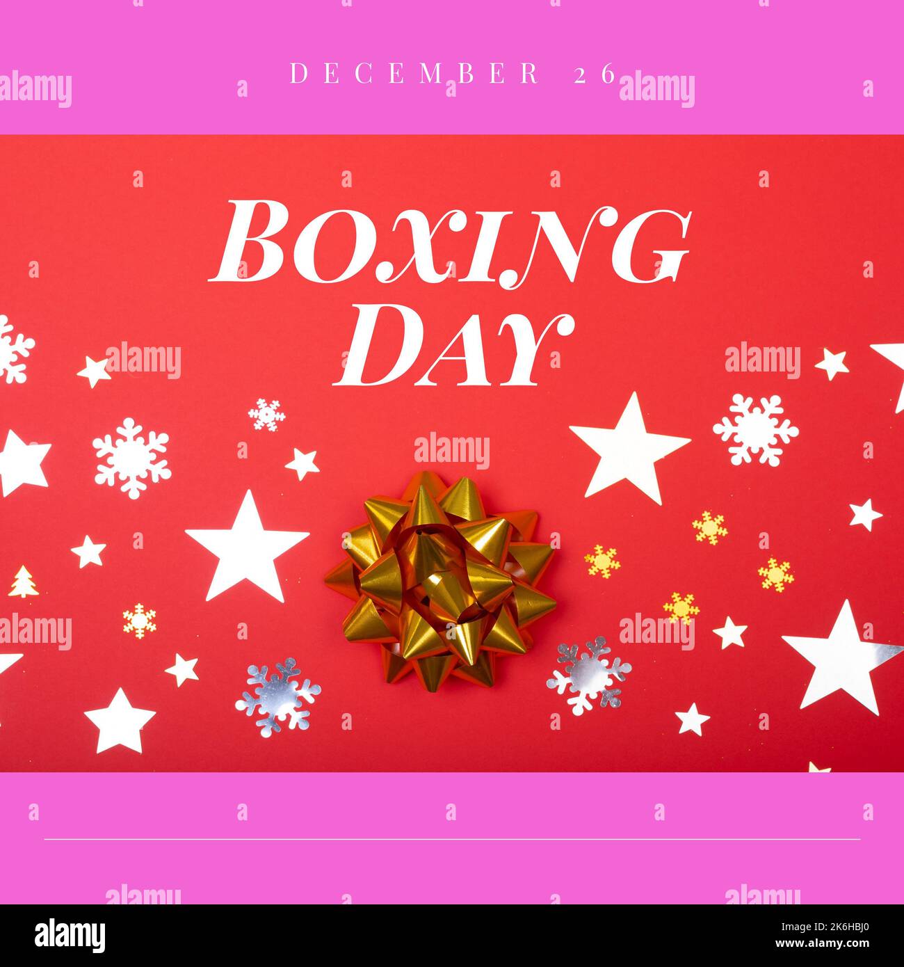 Composition of boxing day text over christmas decorations on red ...